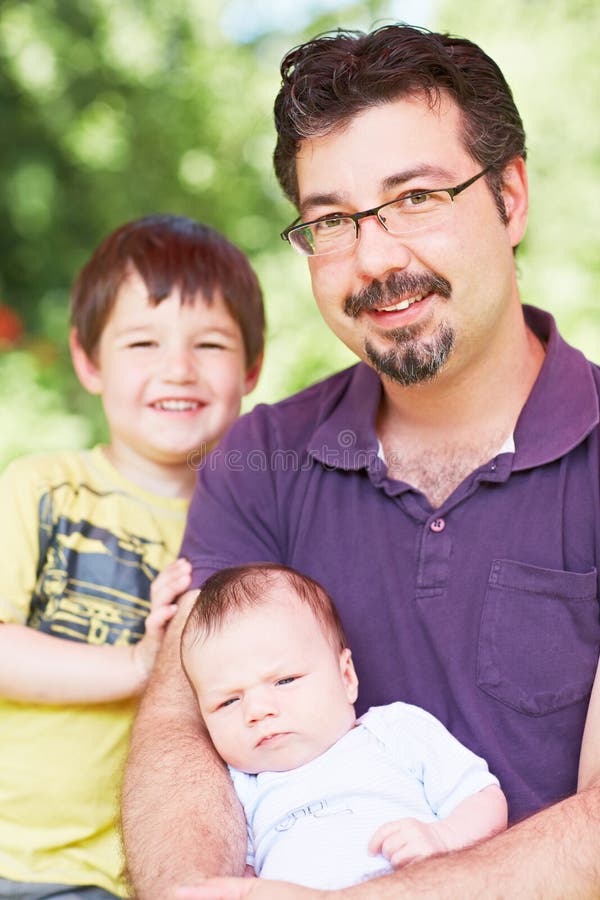 Father with two sons stock image. Image of brothers, responsibility ...