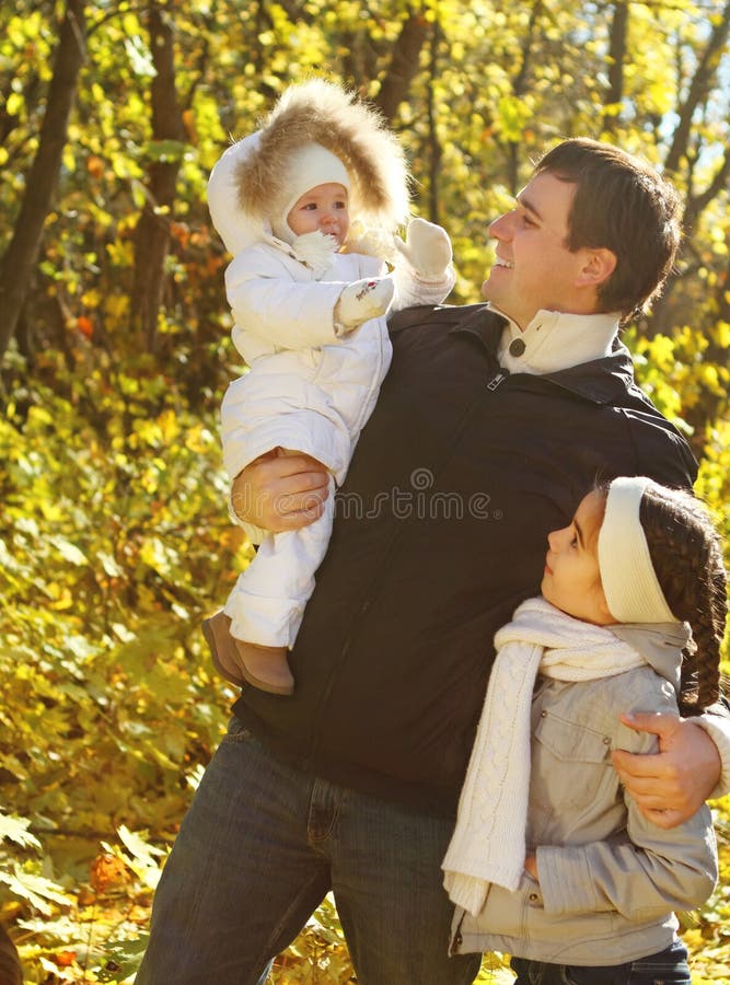 Father with Two Daughters in Autumn Park Stock Photo - Image of ...