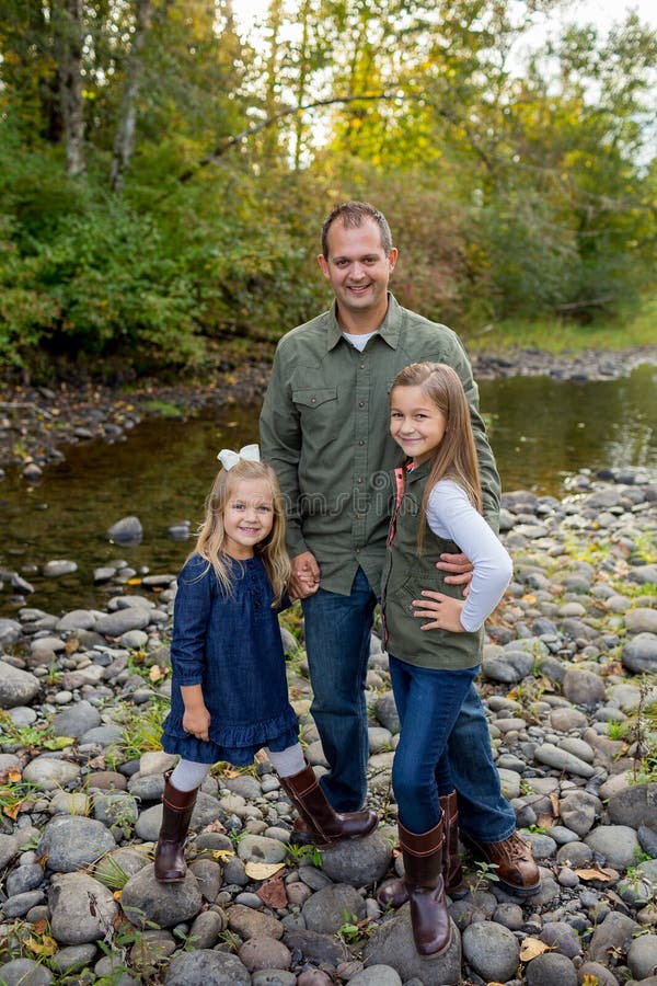 Father with Two Daughters stock image. Image of young - 82658997