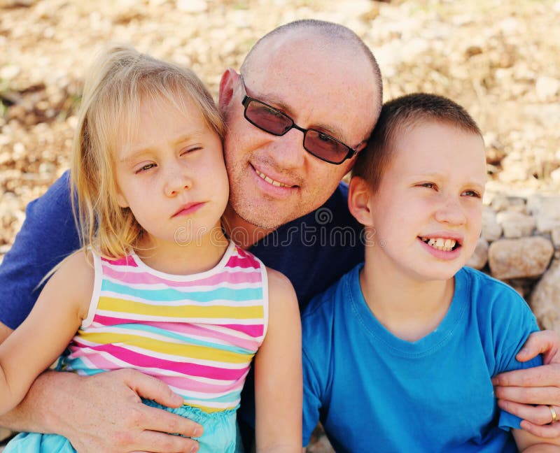 Father with two kids o stock image. Image of father, love - 30962823