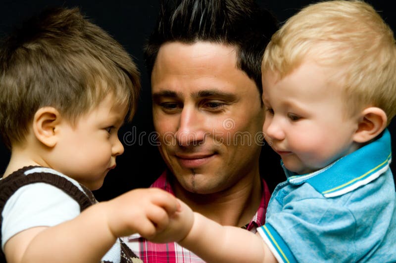 Father with two sons stock image. Image of parenthood - 15954707