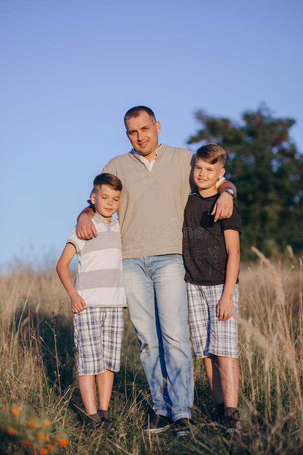 Mom and two sons stock photo. Image of child, outdoor - 121373524