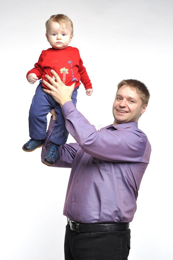 Father in Violet Shirt Holds Little Boy Stock Image - Image of father ...