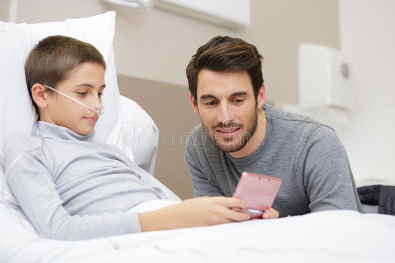 Father Visiting Child in Hospital on Oxygen Playing Computer Game Stock ...
