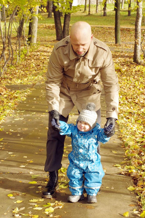 Father Walking with Baby Son Outdoors in Autumn Stock Photo - Image of ...