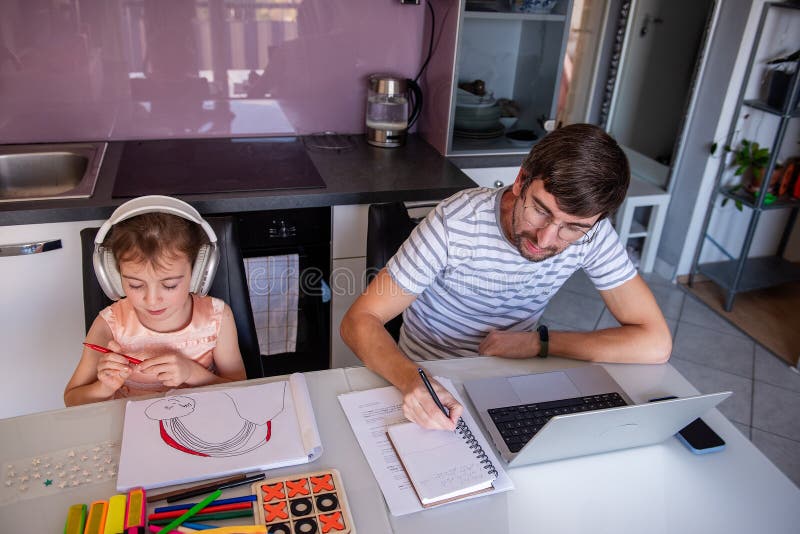 Father Working from Home while Taking Care of Drawing Daughter Stock ...