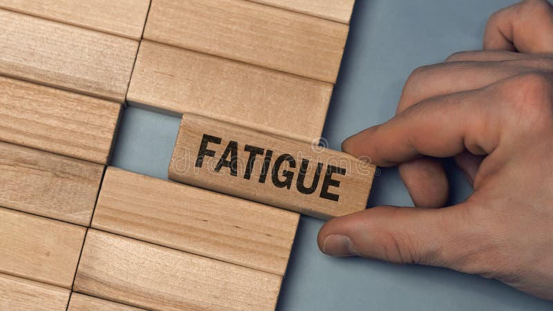 FATIGUE Word Concept. Close-up Wooden Piece Blocks on the Table Stock ...