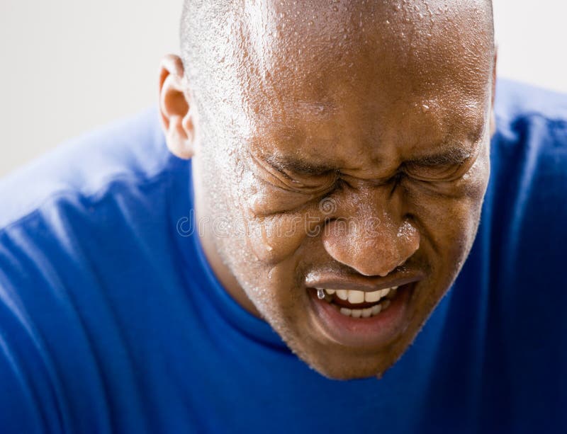 Fatigued man grimacing stock photo. Image of sweating - 6597776