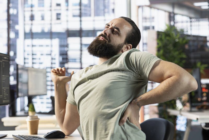 Fatigued Man with Sore Back while Analyzing Data on Computer Stock ...