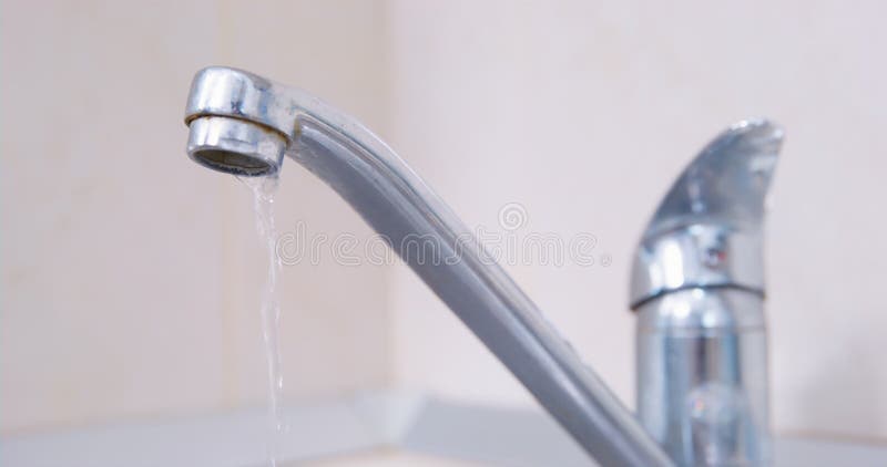 Faucet is Fully Open, but Water Barely Flows Out of it in Thin Trickle ...