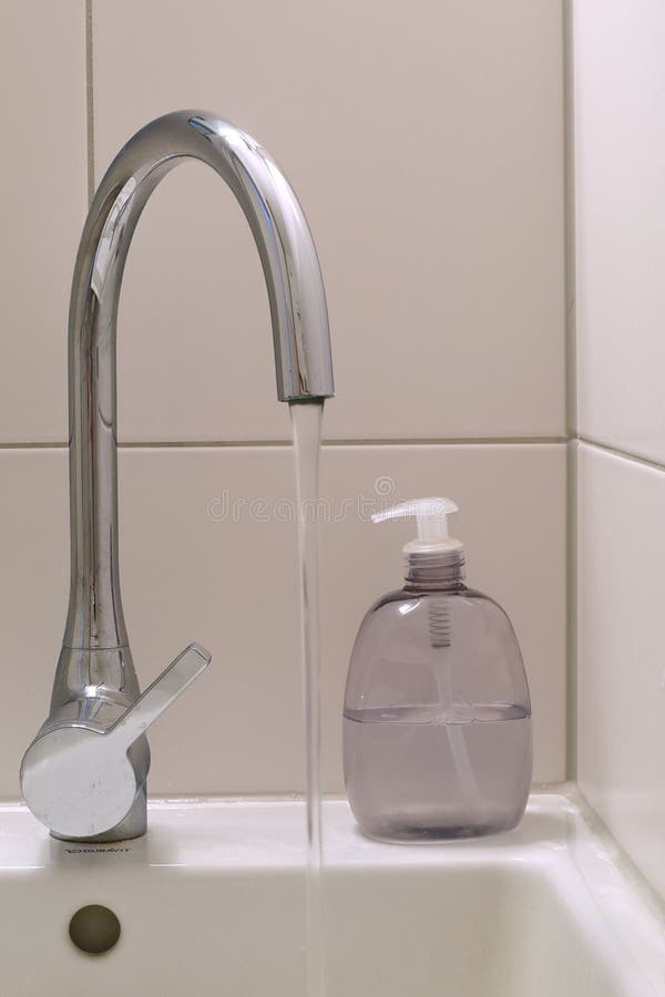 A Faucet at Washbasin in a Toilet Room Stock Photo - Image of liquid ...