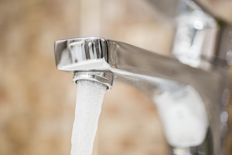 Faucet and Water. Water Tap with Flowing Water. Working Water Tap Stock ...