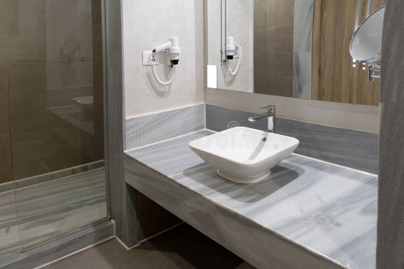 Faucet for Water and White Sink on Marble Counter Stock Photo - Image ...