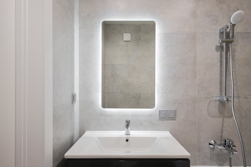 Faucet with Ceramic Sink and Mirror in the Bathroom Stock Photo - Image ...