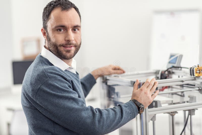 Pleasant Young Engineer Posing with 3D Printer in Office Stock Photo ...