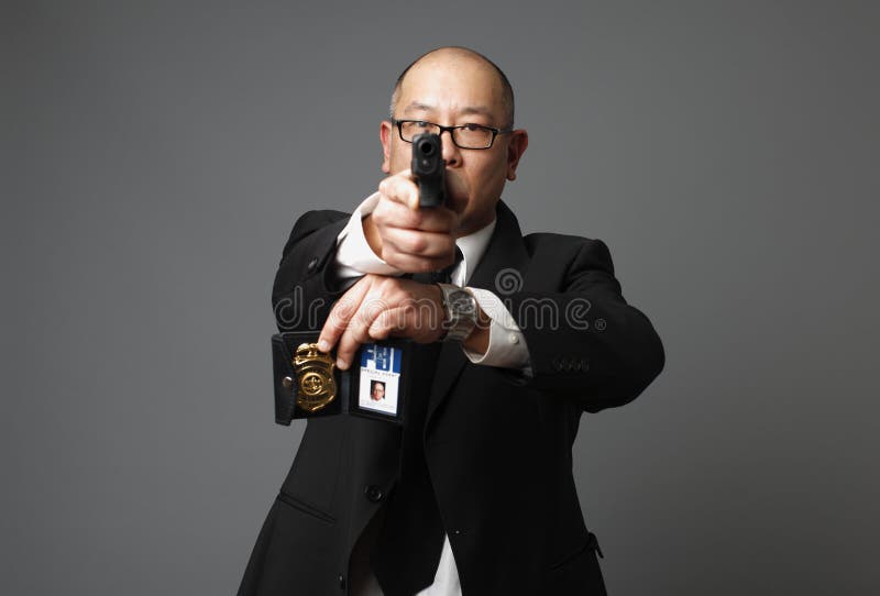 FBI Agent with Gun and Badge Stock Photo - Image of fashion, badge ...