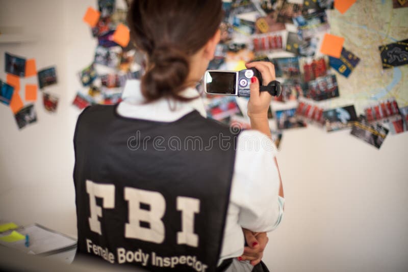 FBI Female Agent Using Camera Stock Image - Image of dtective, clues ...
