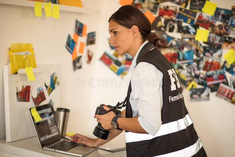 FBI woman works on a case. stock photo. Image of ethnicity - 222605486