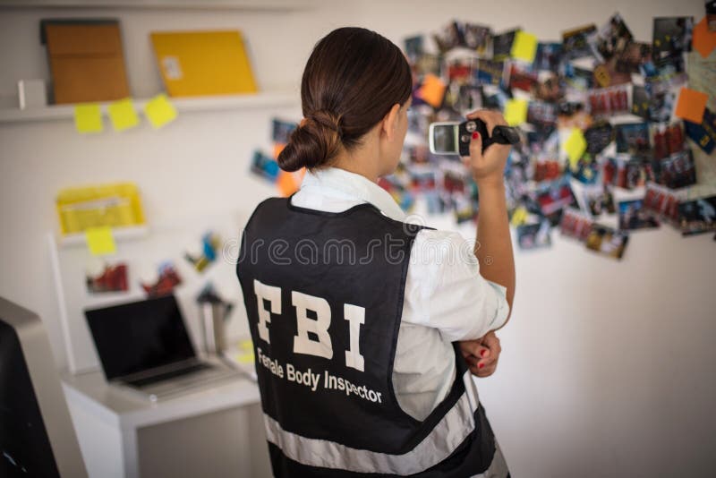 FBI woman works on a case stock photo. Image of case - 214471348
