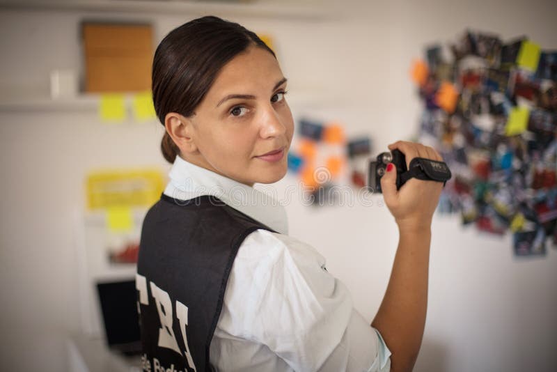 FBI Woman Works on a Case. Using Camera Stock Photo - Image of criminal ...