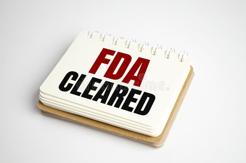 FDA Cleared Words on White Notebook and Grey Cat Stock Image - Image of ...