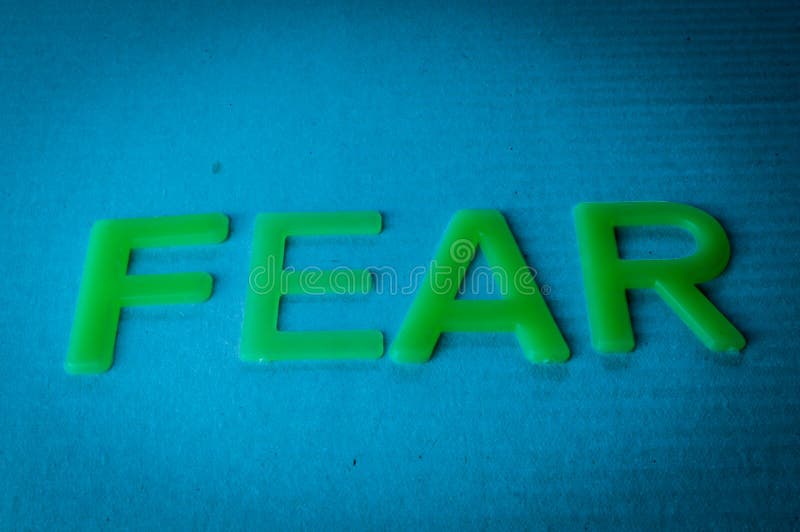 Fear. Word Made by Green Letters on Blue Background Stock Photo - Image ...