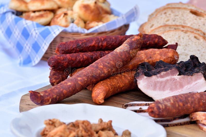 Feast on the Table, Bacon, Sausages, Bread, Meat. Close-up of Sausages ...
