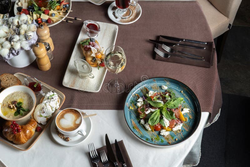 Feast Table with a Variety of Entrees, Porridge, Steaks, Desserts ...