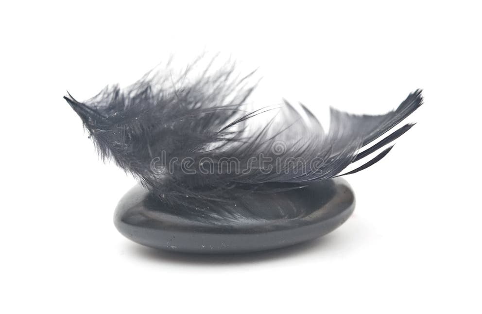 Feather Balancing on Stack of Black Stones Stock Image - Image of ...
