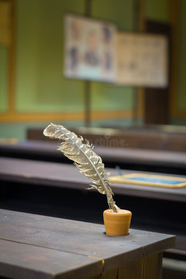 Feather in inkwell stock image. Image of correspondence - 138664125