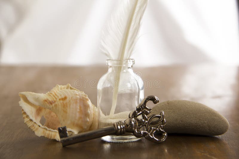 Feather,Key,Sea Shell stock photo. Image of literature - 45688238