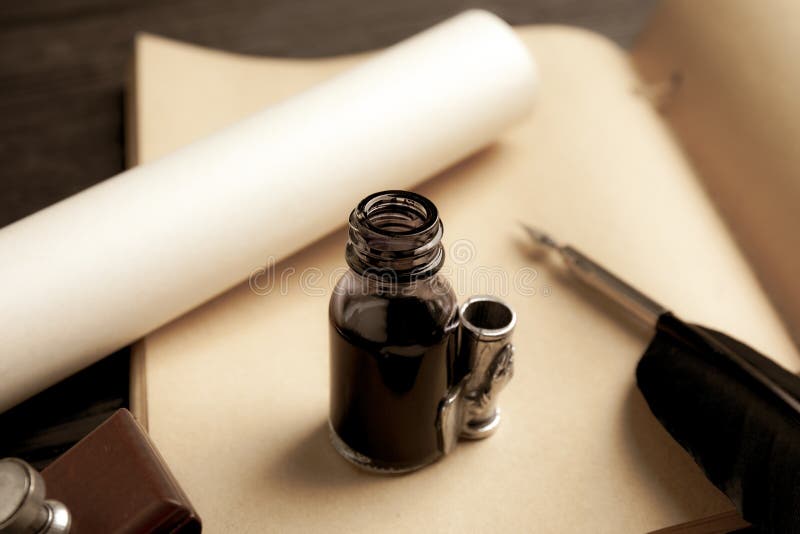 Feather Pen and Bottle of Ink on Notebook Stock Image - Image of ...