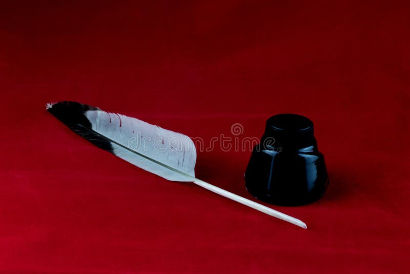 Quill Feather Pens with Ink Bottle and Sheet of Writing Paper on a Red ...