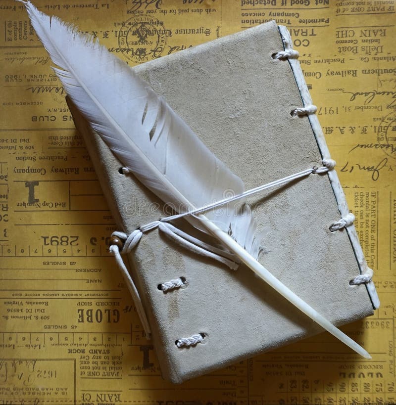 Feather Quill Pen with Old Handmade Leather Notebook Closeup Editorial ...