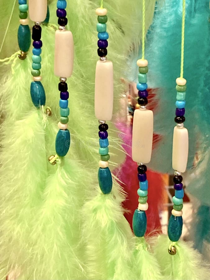 Feathers and Strings of Beads Stock Photo - Image of cream, teal: 296213600