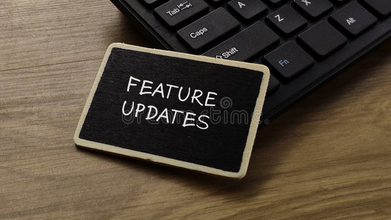 Feature Updates Concept with Keyboard and Blackboard Stock Photo ...