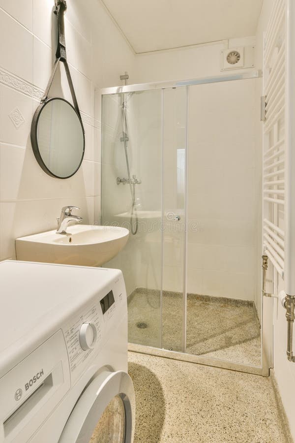 Modern Bathroom with Laundry Facilities Stock Photo - Image of ...