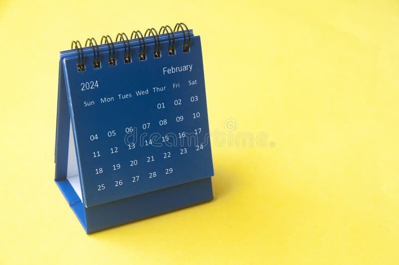 February 2023 Blue Desk Calendar on Yellow Cover Background with ...
