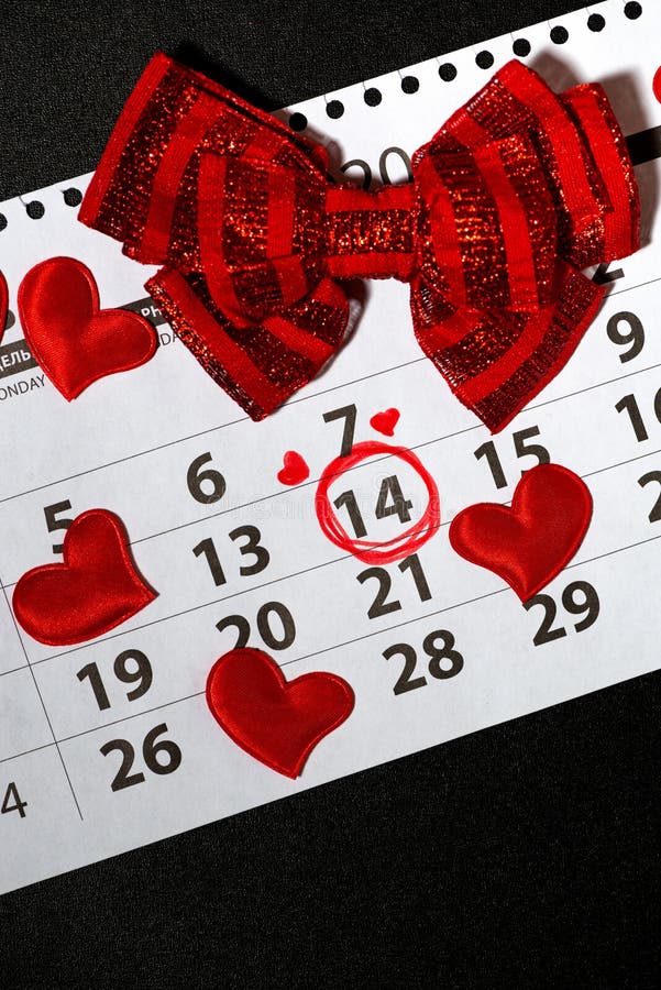 February 14 on a Calendar Sheet, Red Hearts, Holiday Attributes ...