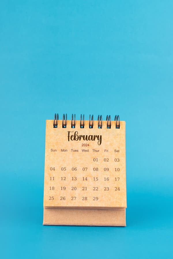February 2024 White Desk Calendar on Blue Background Stock Image ...