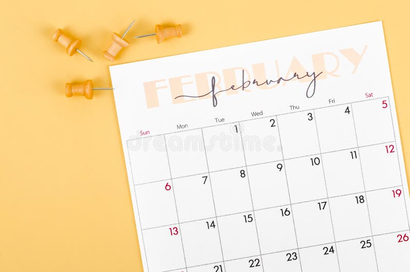 February 2022 and Wooden Push Pin on Yellow Background Stock Image ...