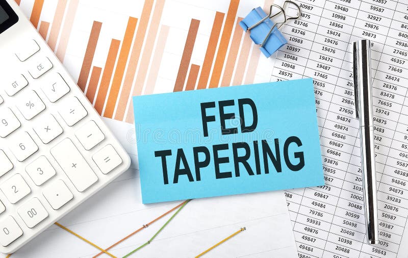 FED TAPERING Text on Folder with Chart and Calculator on White ...