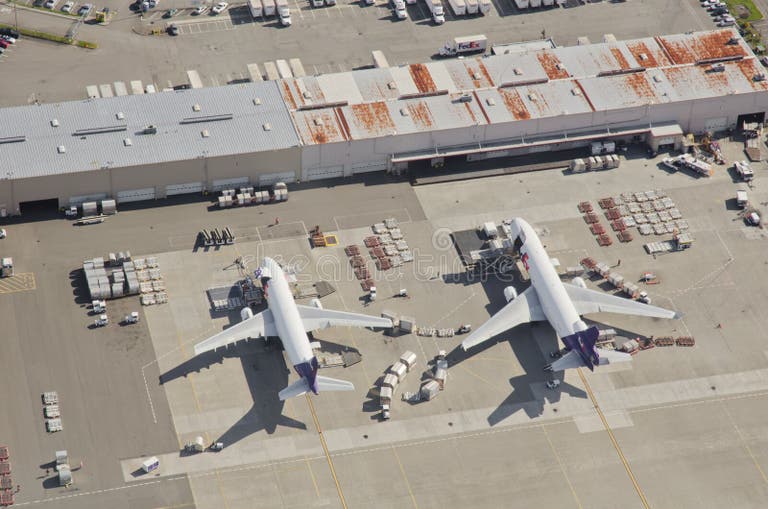 FedEx Airliners Unloading at Busy Airport Editorial Stock Image - Image ...