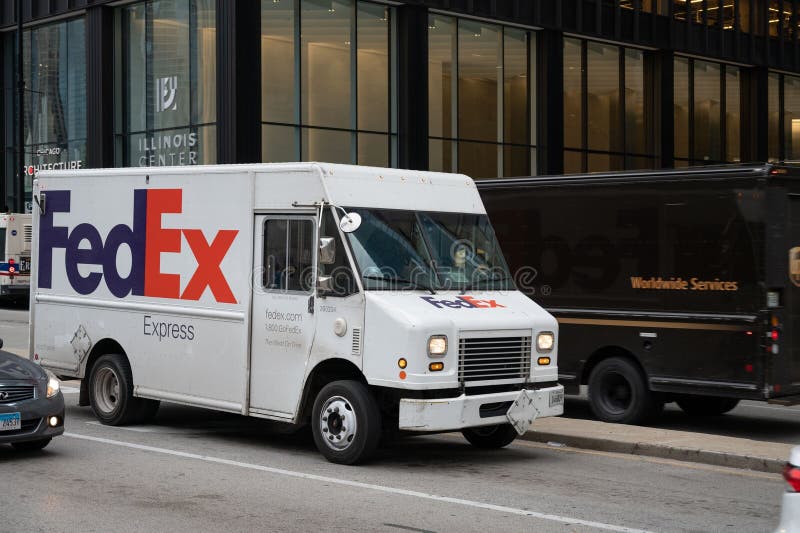 FedEx Delivery Driving in a Busy Street Editorial Stock Image - Image ...