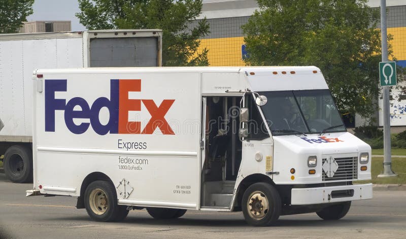 A Fedex Delivery Service Truck Van on the Route during Spring Editorial ...