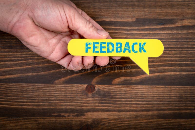 Feedback Concept. Yellow Speech Bubble in a Man& X27;s Hand Stock Photo ...