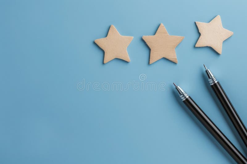 Customer Feedback Form with Wooden Stars and Pens on a Blue Backdrop ...
