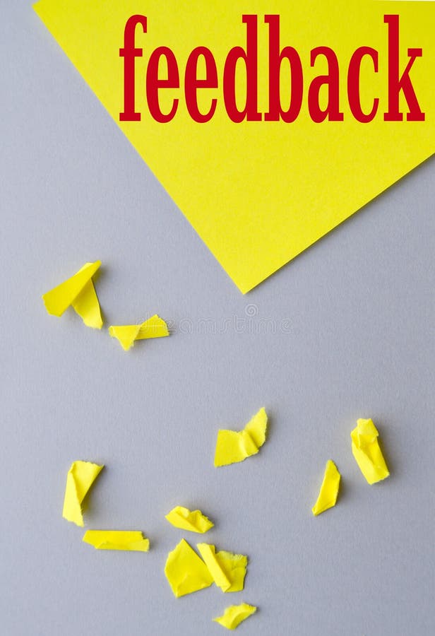 Feedback Text Written on Yellow Background, Gray Desktop with Torn ...