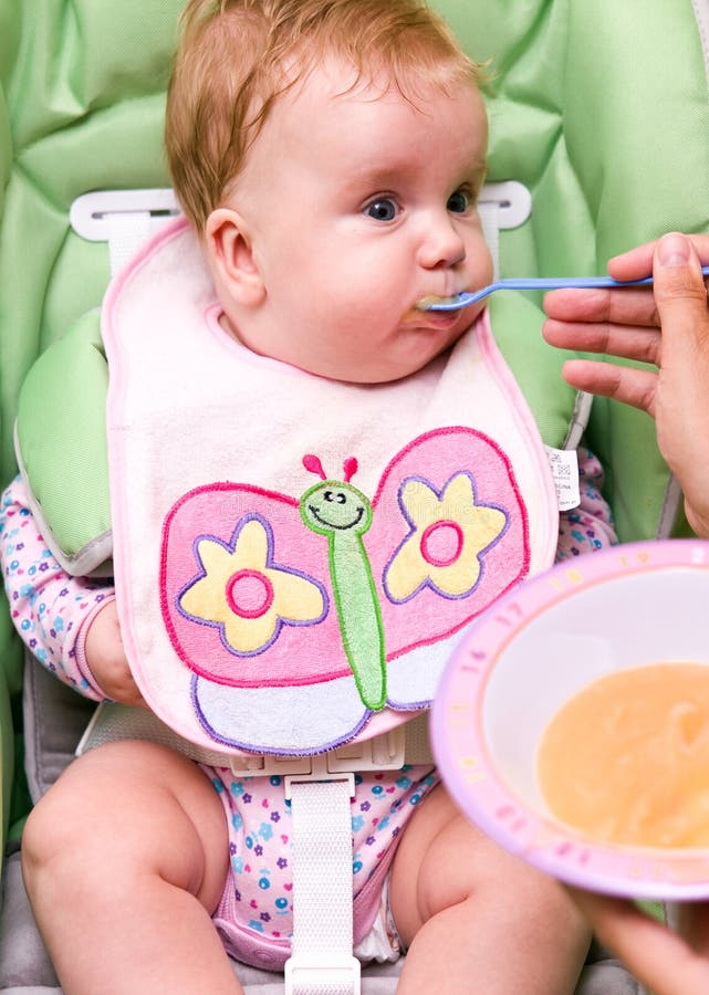Feeding a baby stock photo. Image of feed, nutritious - 15702628