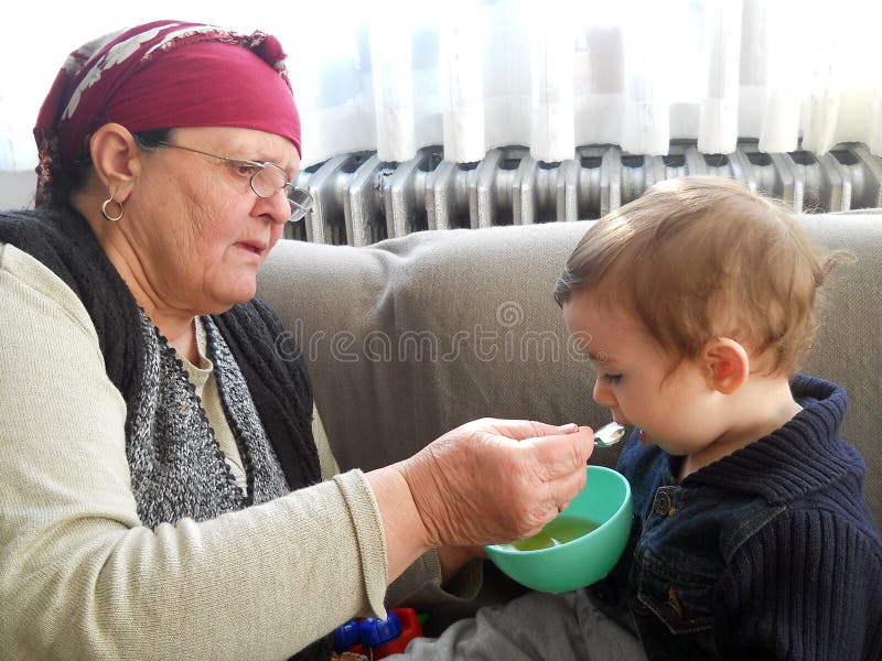 Feeding the baby stock photo. Image of love, grand, drinking - 24293480